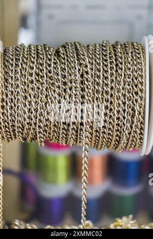 Rolls of decorative chains in view Stock Photo - Alamy