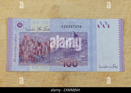 RM100 banknote on the back side of the 100 Ringgit bill are rock formations of Gunung Api Valley ...