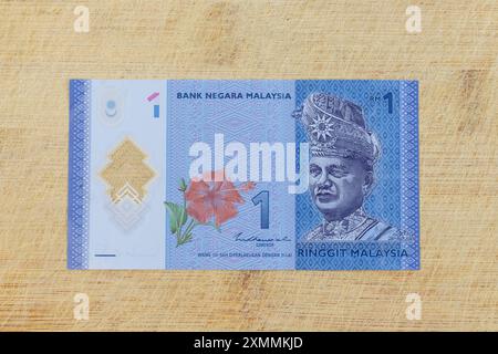 The bright blue polymer plastic banknote of 1 Malaysian Ringgit ...