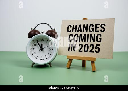 Changes coming in 2025. Paper with a text in a woman's hand Stock Photo ...