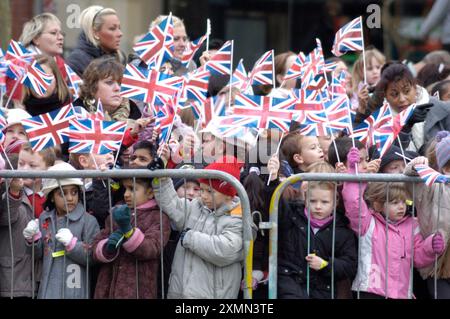 School Children waiting for the Queen to pass on her walk around ...