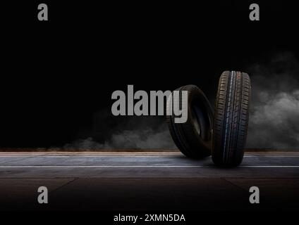 Stack of Tires on an Empty Road with dark Background Stock Photo - Alamy