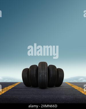 Stack of Tires on an Empty Road with Blue Sky Background Stock Photo ...
