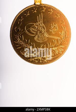 Turkish Ottoman style gold coin white background Stock Photo - Alamy