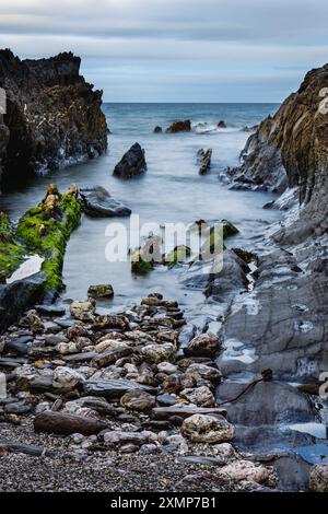 The rocky coastline at Westcombe Beach in South Devon Uk Stock Photo ...