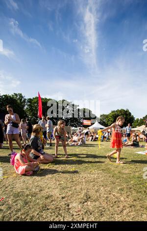 Children play on a field where events are held to celebrate the Dragon ...