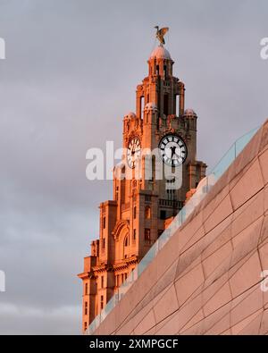 Liverpool waterfront skyline at golden hour with dramatic reflections ...