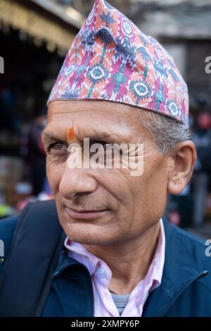 Nepalese gentleman wearing traditional dhaka topi cap or hat in streets ...