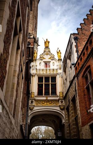 Brick stepped gable and Blind Donkey portal in Bruges, Belgium Stock ...