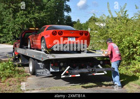 A Corvette being loaded on a Rollback Wrecker for transport Stock Photo ...