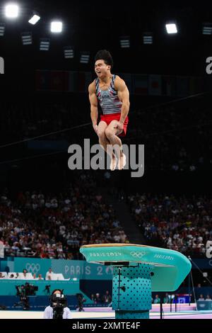 Asher Hong, of United States, competes on the vault during a men's ...