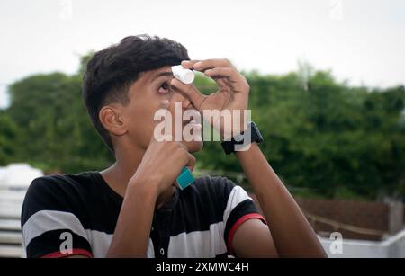 eye flu, acute conjunctivitis patient, asian patient has red eyes and ...