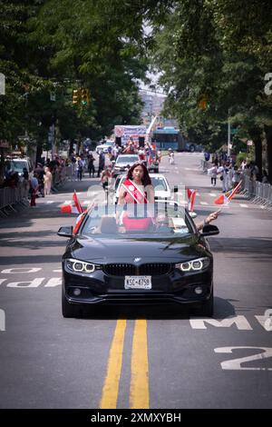 A 2024 Peruvian Parade Queen rides in a 2023 Mazda MX-5 convertible on ...