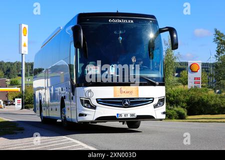 White Mercedes-Benz Tourismo coach bus on road on a beautiful day of ...