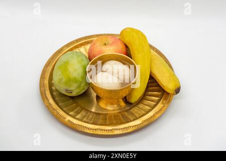 Puja Thali with Apple Banana Mango Fruits and Indian Sweets Rasbhari ...