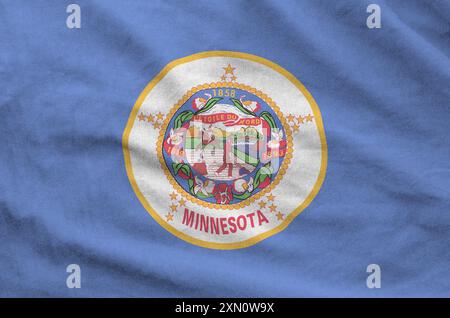 Minnesota US state flag depicted on folded wavy fabric of old cloth ...