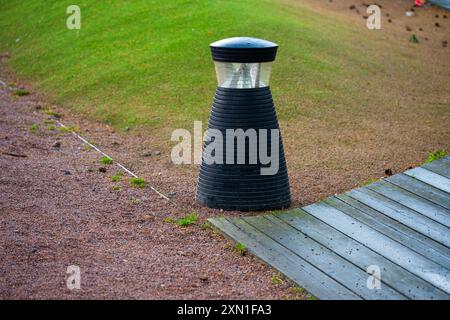 Round low park light by a walkway Stock Photo - Alamy