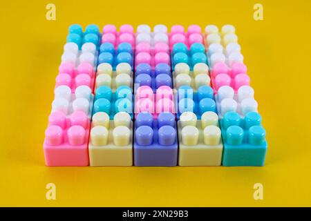 Colorful puzzle cubes background, geometric figures, table game ...