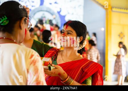 A beautiful woman playing sindur khela on the occasion of vijya dashmi ...