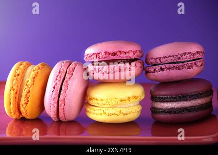 Array of macaroons coming in shades of yellow and pink, textures and ...