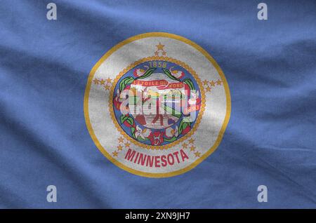 Minnesota US state flag depicted on folded wavy fabric of old cloth ...