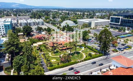 A view of a busy street surrounded by modern buildings at late night ...