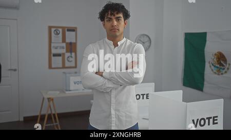 Hispanic man standing by election room puffing cheeks with funny face ...