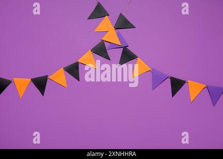 Garlands made of paper flags for Halloween celebration on white ...