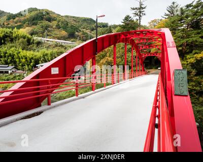 Red bridge over the Kiso river at Kiso-no-Kakehashi, a scenic spot in ...