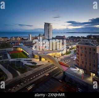 Illuminated bridge and arena at dusk. Swansea Arena and Copr Bay Bridge ...