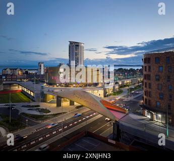 Illuminated bridge and arena at dusk. Swansea Arena and Copr Bay Bridge ...