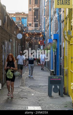 People walking along Bussey Alley in Peckham Rye, London Stock Photo ...