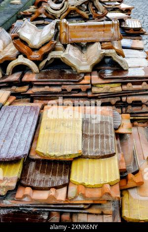 A pile of neatly stacked used tiles Stock Photo - Alamy