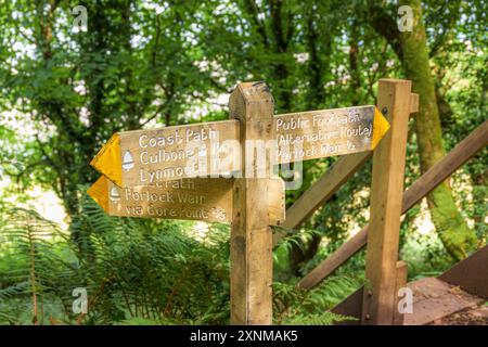 A waymarking sign on the South West Coast Path to Culbone church and ...