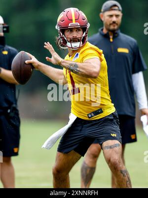 Washington Commanders quarterback Sam Hartman walks on the field before ...