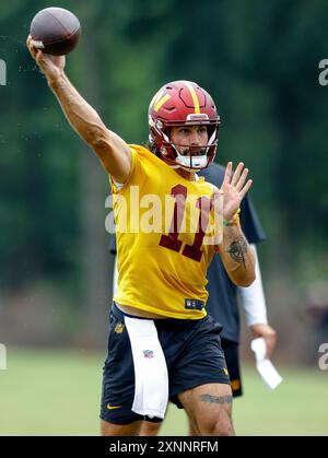 Washington Commanders quarterback Sam Hartman (15) works out during NFL ...