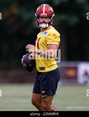 Washington Commanders quarterback Sam Hartman (15)warms up before the ...