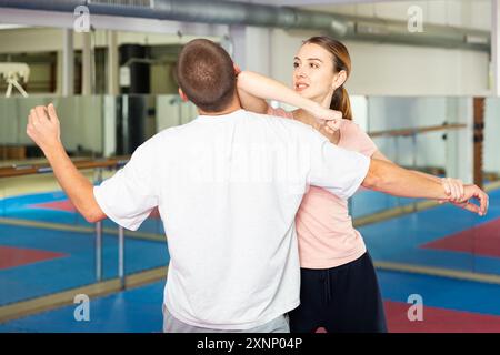 Woman performing elbow strike during self-defence training Stock Photo ...