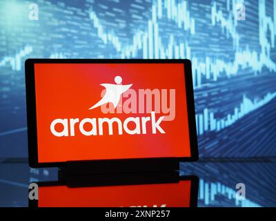 In this photo illustration, the Aramark logo is seen displayed on a ...