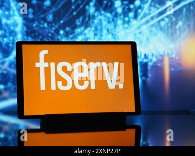 In this photo illustration, a Fiserv, Inc. logo seen displayed on a ...