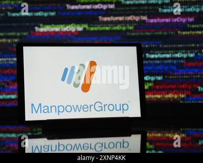 In this photo illustration, a ManpowerGroup Inc. logo seen displayed on ...