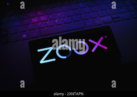 In this photo illustration, Zoox Inc. logo seen displayed on a ...