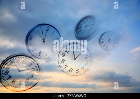 Clocks and sky lit by sunset, double exposure. Time concept Stock Photo ...