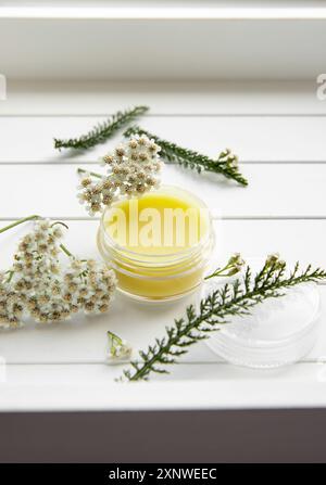 Balm made with Achillea millefolium, yarrow or common yarrow. Jar with ...