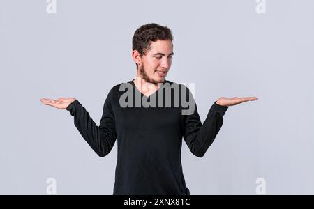 Man balancing the palms of his hands, man comparing with the palms of ...