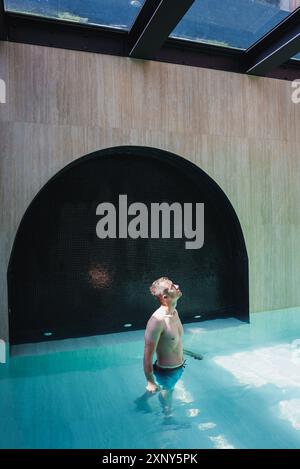 Luxurious Indoor Spa with Circular Pool and Decorative Fountain Stock ...