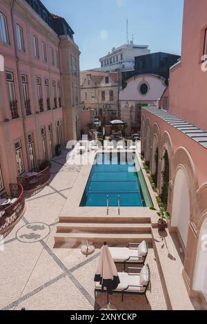 Luxurious Hotel Courtyard with Rectangular Pool and Elegant ...