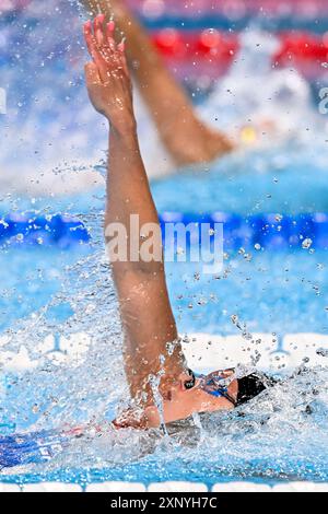 Phoebe Bacon, of United States, competes in the 200-meter backstroke at ...