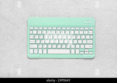 Stylish cyan keyboard on white background Stock Photo - Alamy