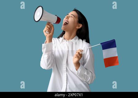 Female French language teacher with megaphone and flag on pink ...